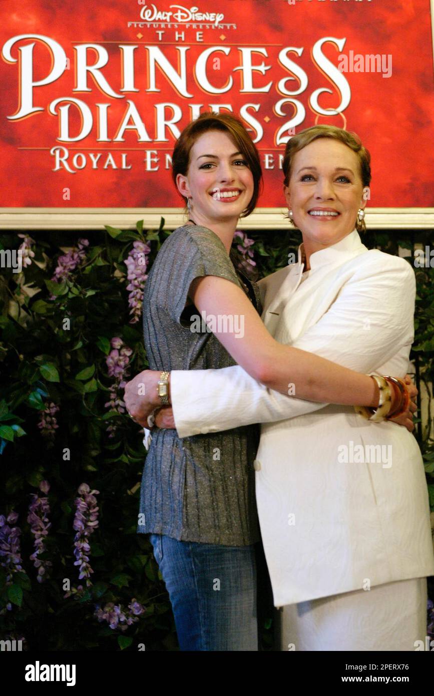 Actresses Anne Hathaway, left, and Julie Andrews hug each other ...