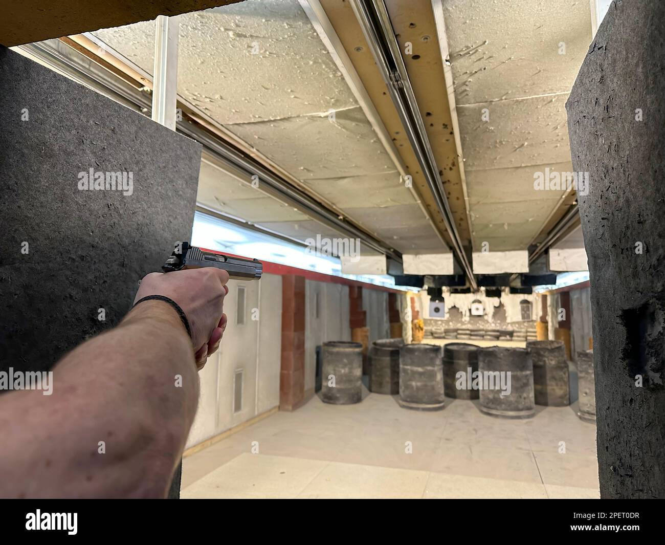 Man Shooting with a 9mm Handgun in Shooting Range in Switzerland Stock ...