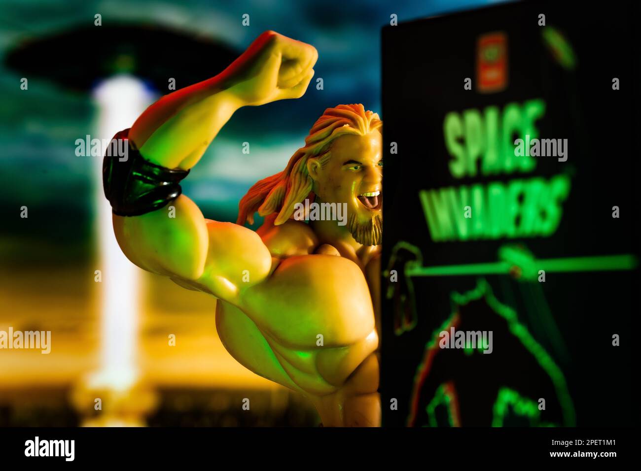 Toy wrestler playing video game Stock Photo - Alamy