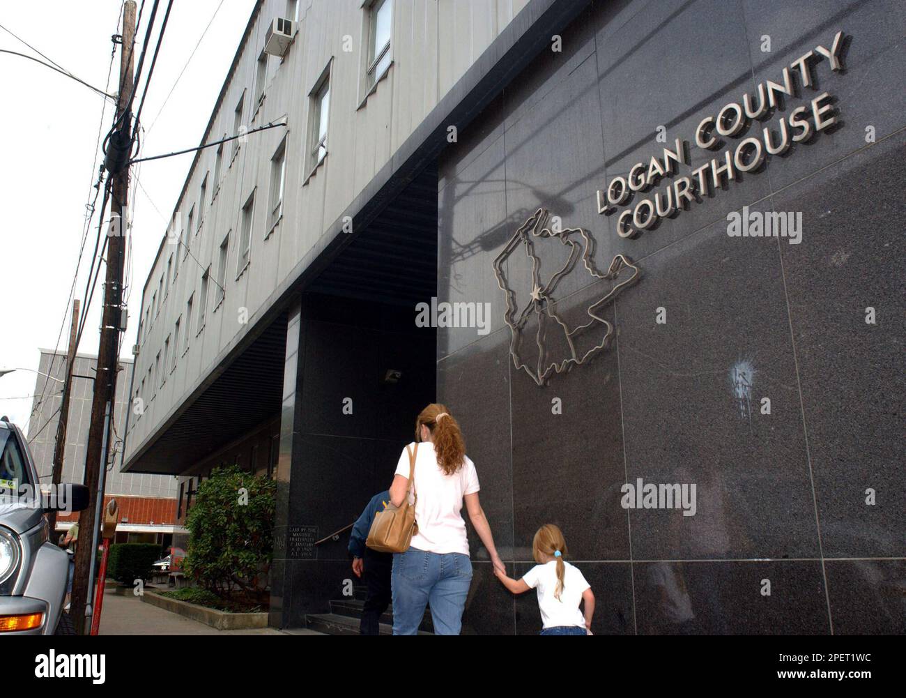 **ADVANCE FOR MONDAY AUG. 9** An outline map of Logan County decorates ...