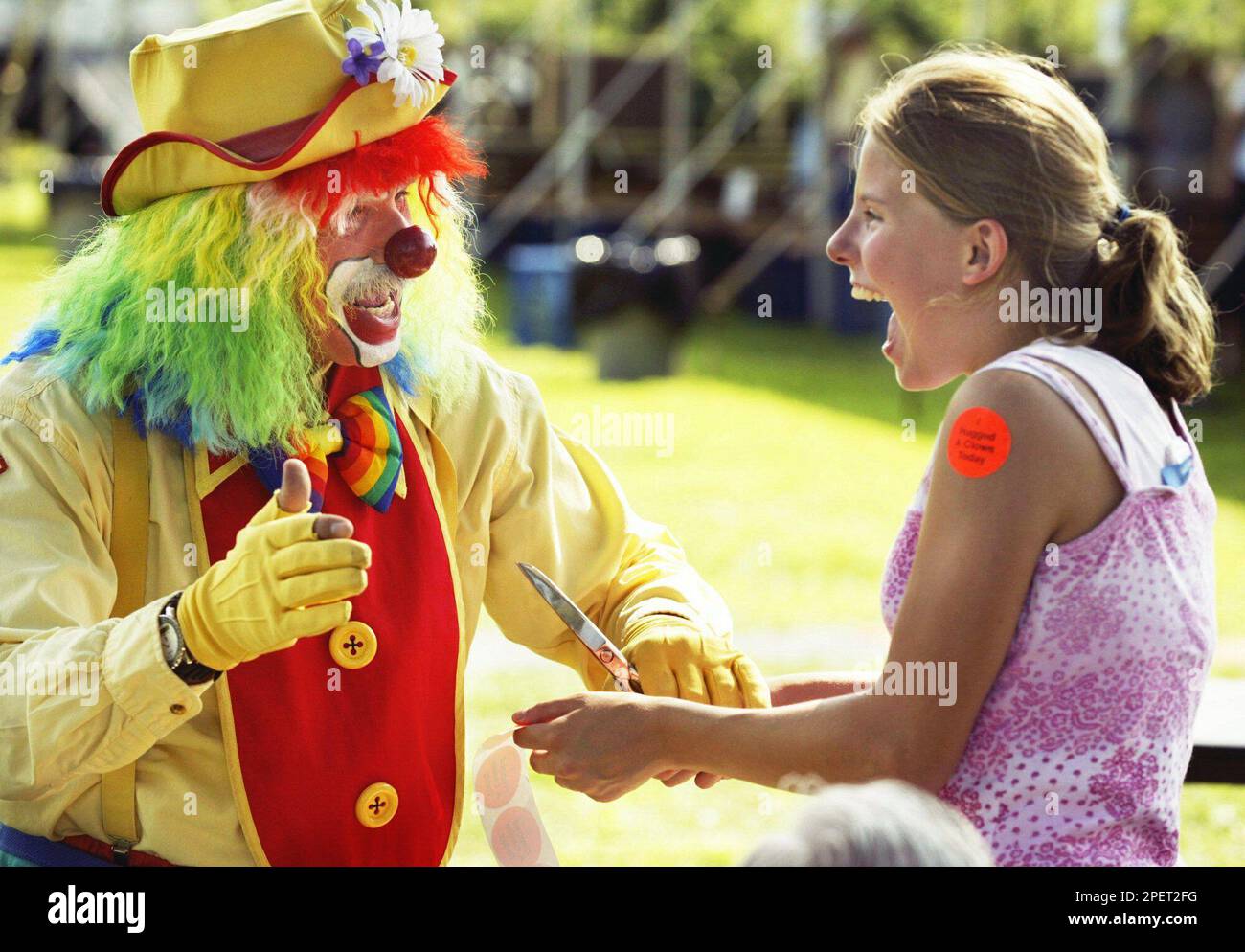 JoJo, the clown, from the Shriner's Pyramid Temple, shows Deenna Lyons ...