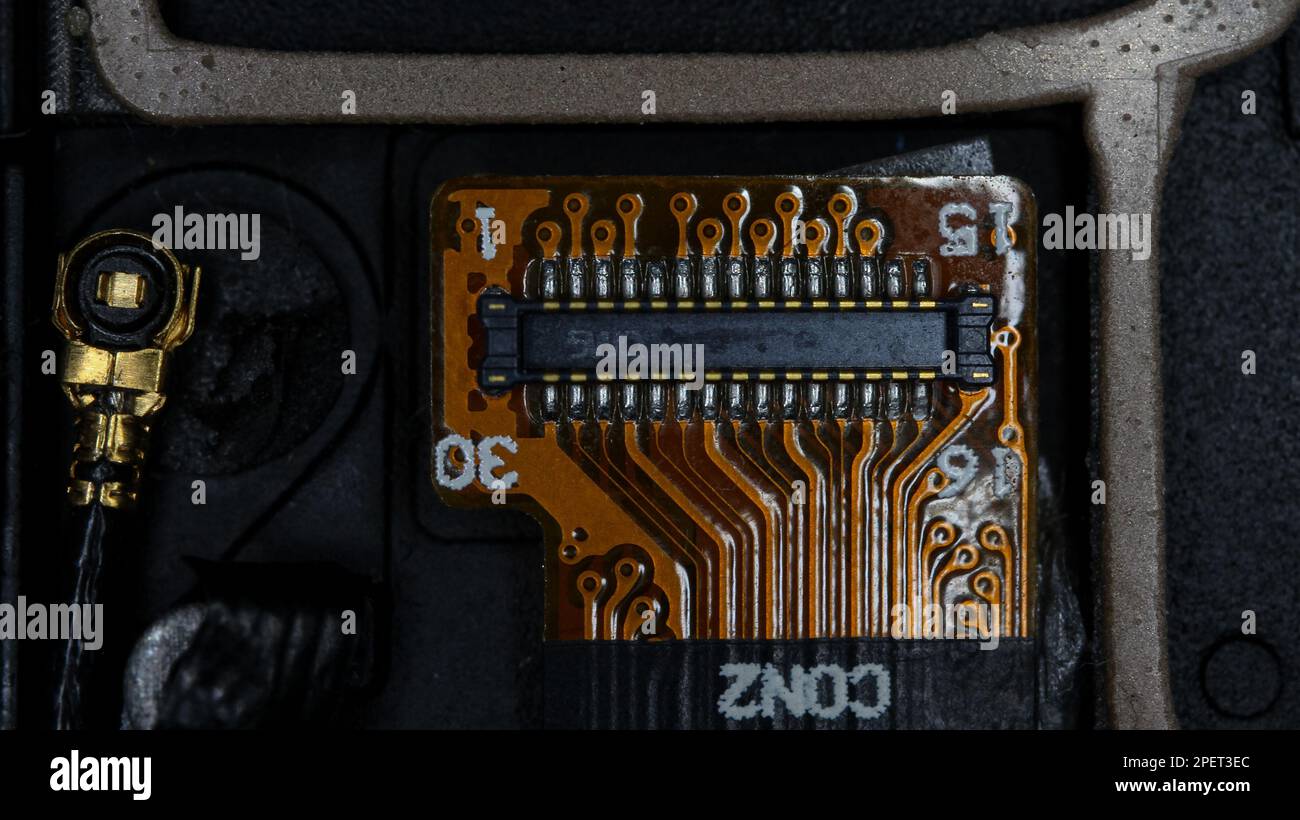 A close-up image of a circuit board with various colored wires and ...