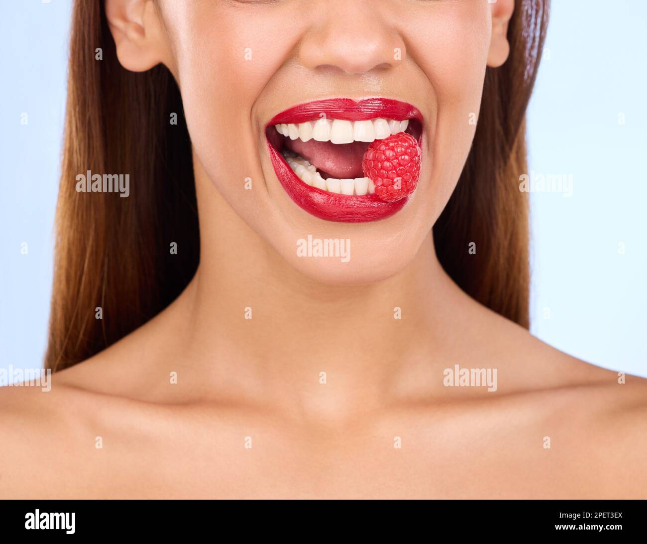Woman mouth eating raspberry hi-res stock photography and images - Alamy