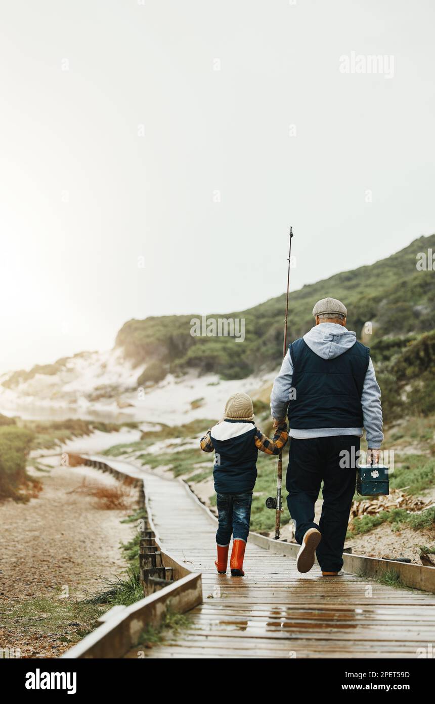 Walking, fishing and grandfather with child outdoor for lesson, leisure ...