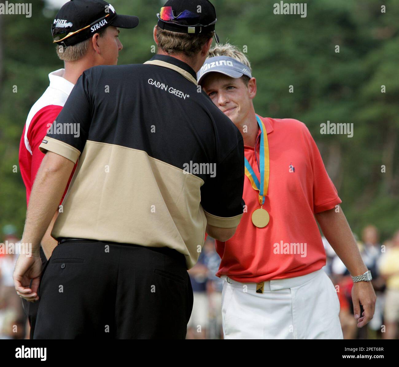 Luke Donald, right, of England, greets Henrik Stenson, left, and Peter ...