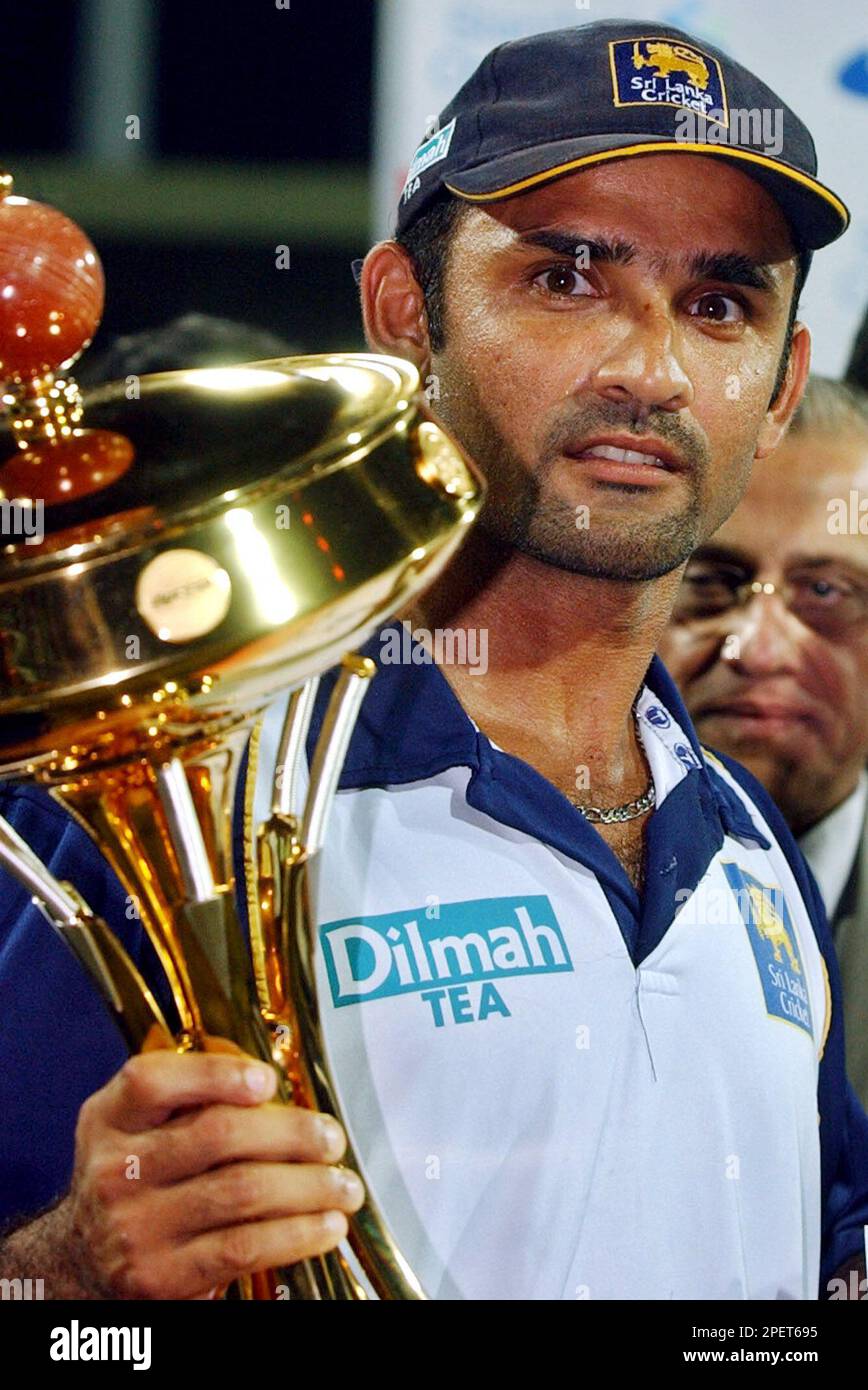 Sri Lanka's cricket captain Marvan Atapattu holds the Asia Cup trophy ...