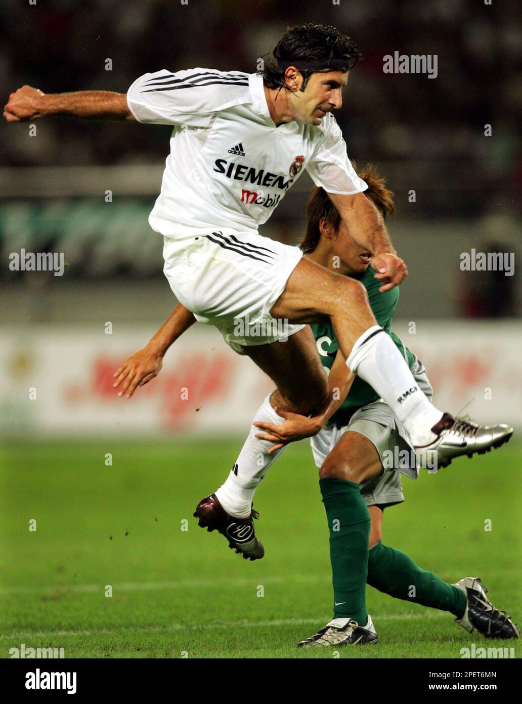 Real Madrid midfielder Figo scores a goal during the second half of a ...