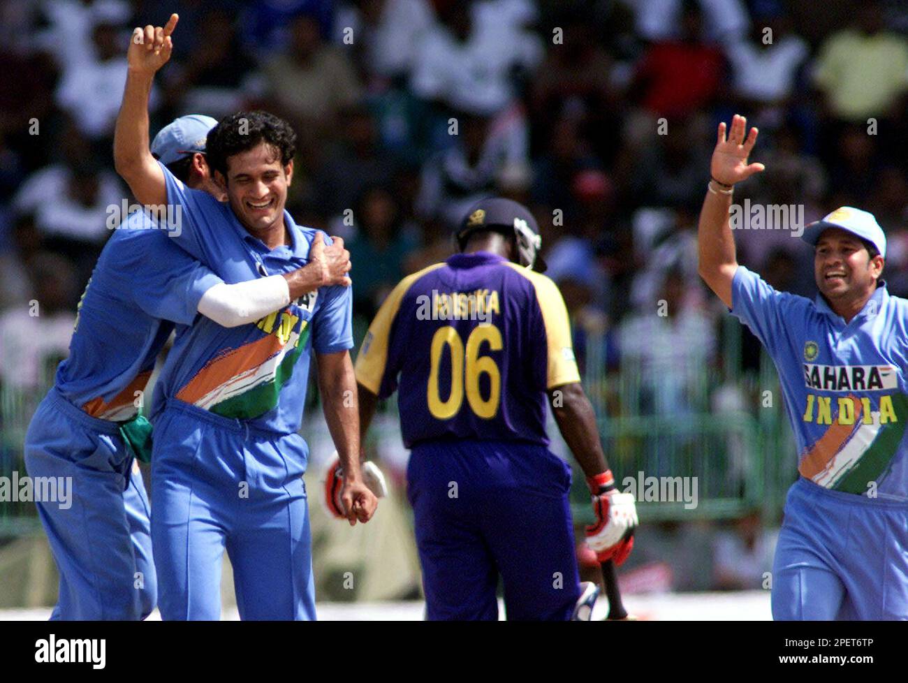 Indian bowler Irfan Pathan, second left, celebrates the dismissal of ...
