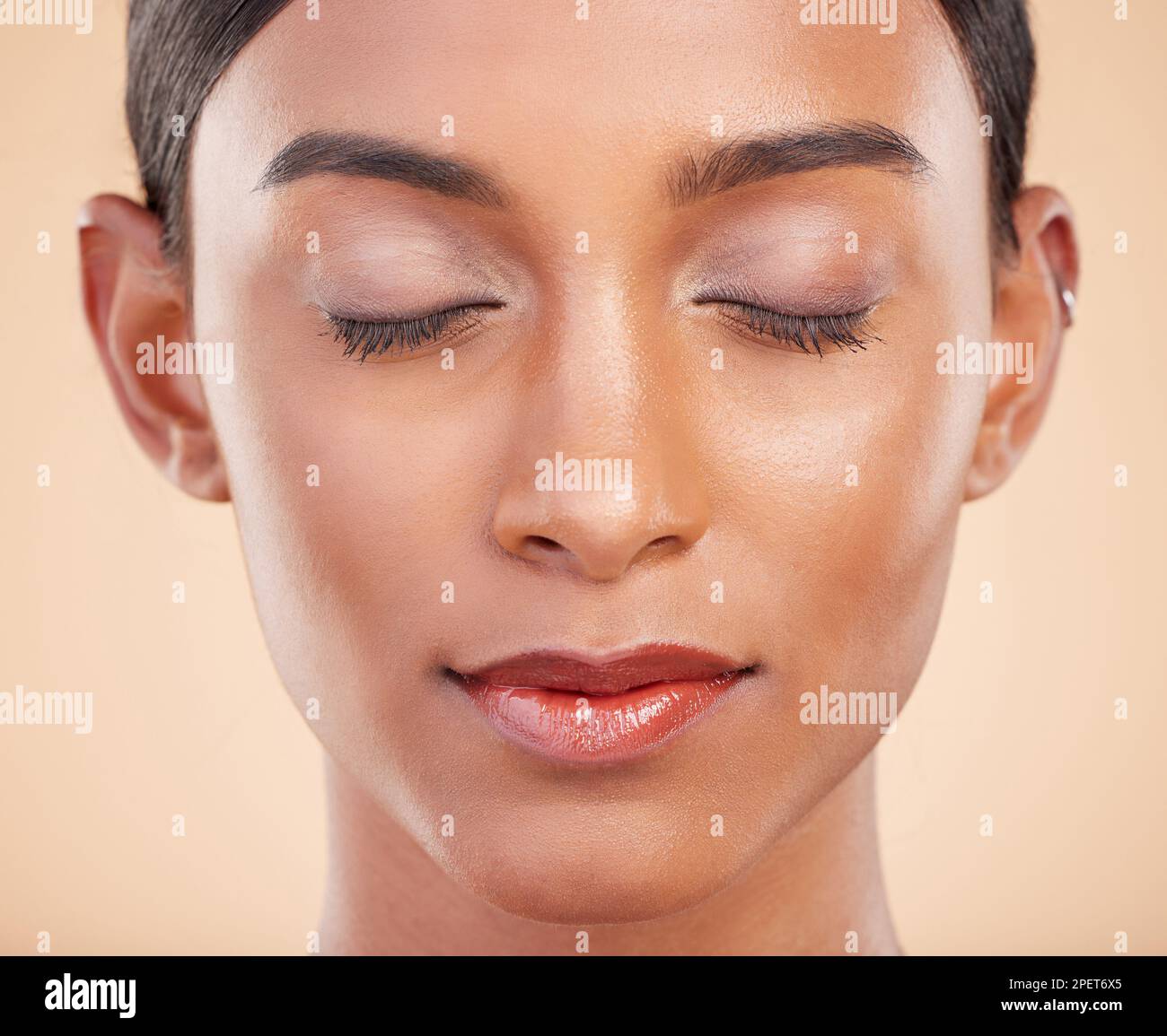 Face, eyes closed or make up on model woman in studio isolated on beige ...