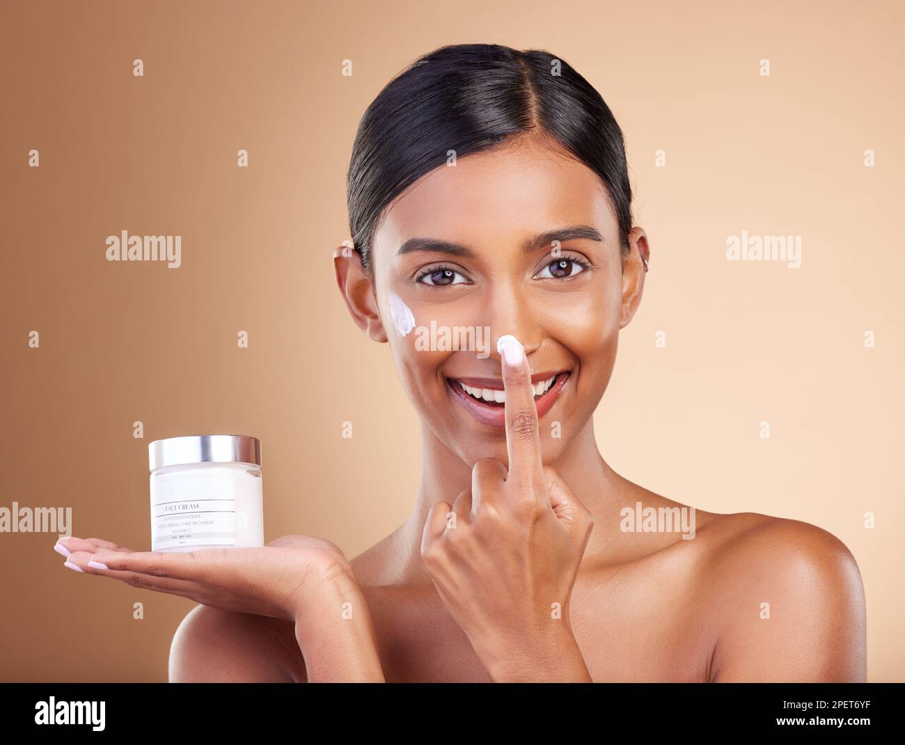 Portrait, product and nose with a model woman in studio on a beige ...