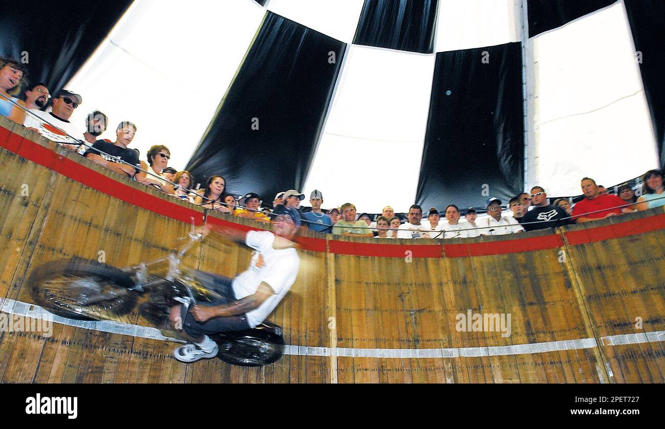Wall of Death motorcycle rider Rhett Rotten performs on his 1957 Harley ...