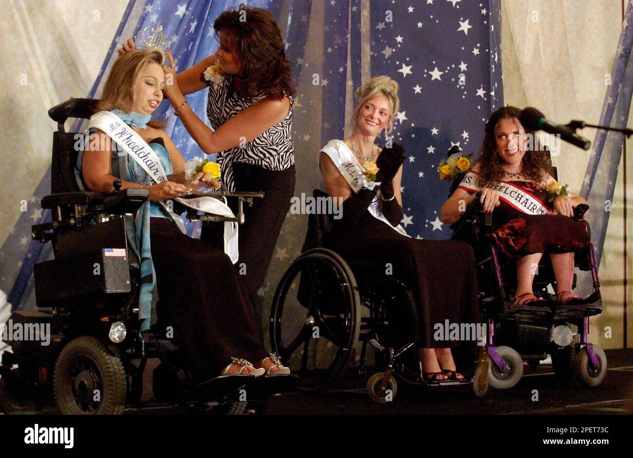 Juliette Rizzo from Maryland, left, is crowned Ms. Wheelchair America ...
