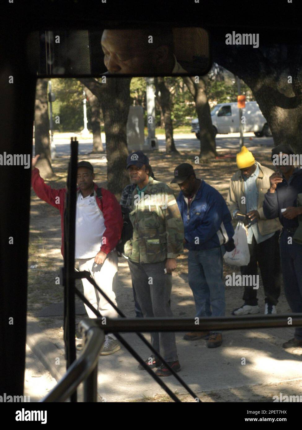 **ADVANCE FOR MONDAY, AUG. 2 ** Bus driver Calvin Darnell is reflected ...