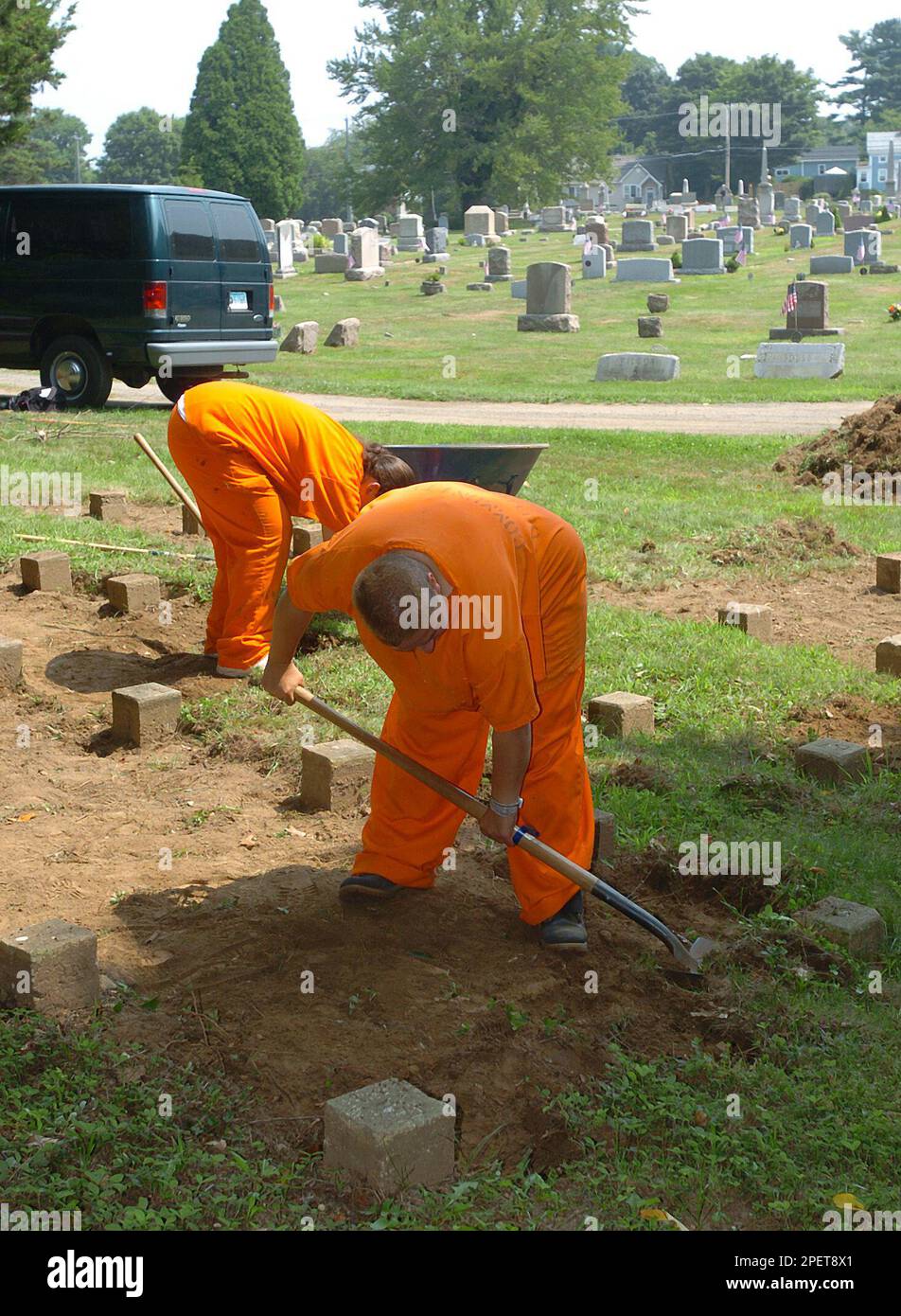Two inmates from York Correctional Institution in Niantic, Conn., dig ...