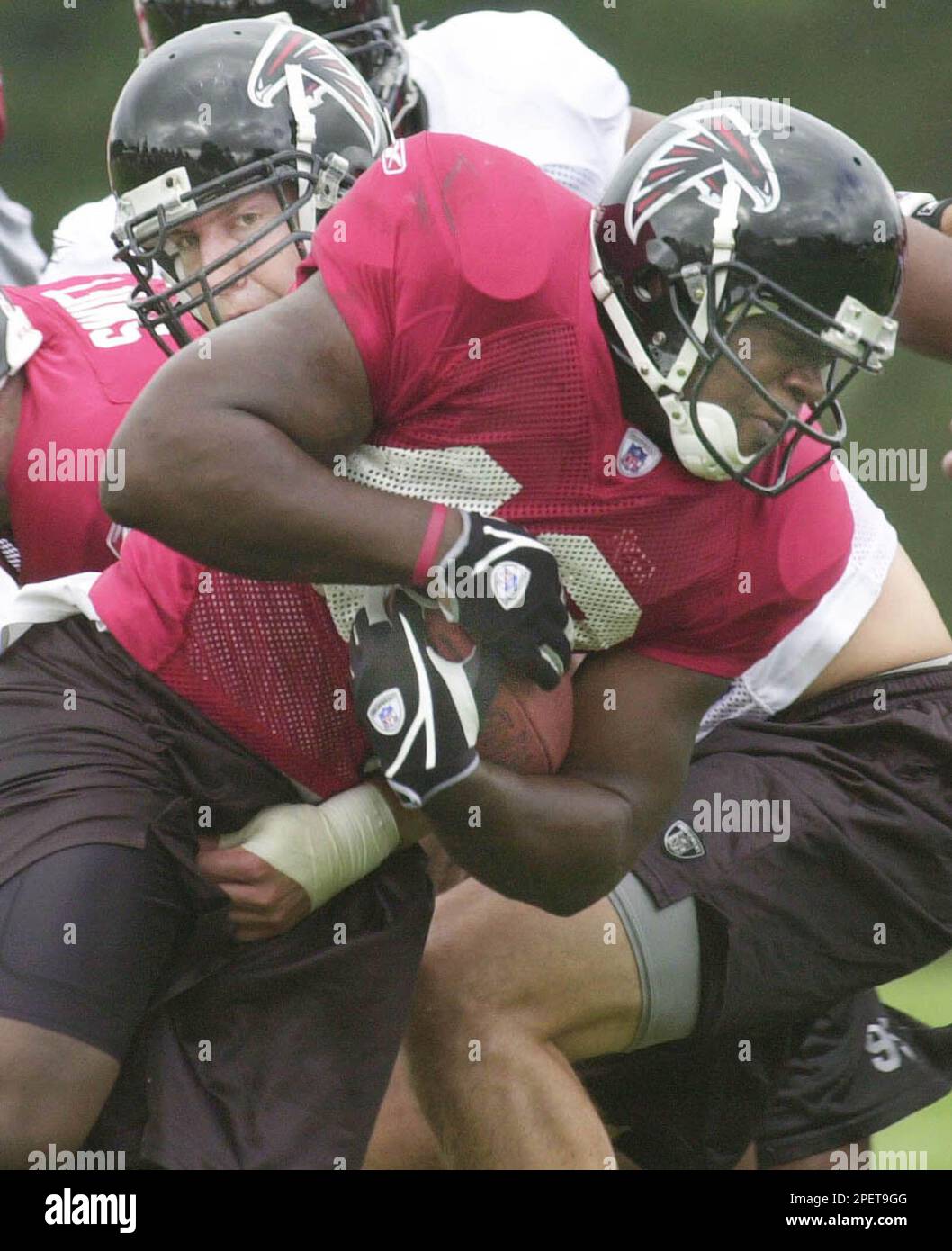 Atlanta Falcons defensive lineman Patrick Kerney stops running back ...