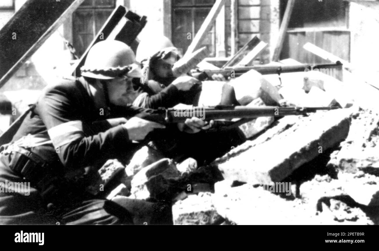 A 1944 photo showing soldiers from the Polish Home Army fighting on a ...