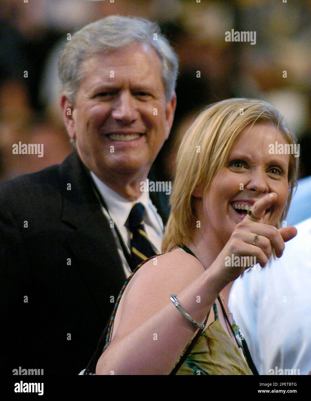Actors Michael Murphy, left, and Cynthis Nixon move through the crowd ...