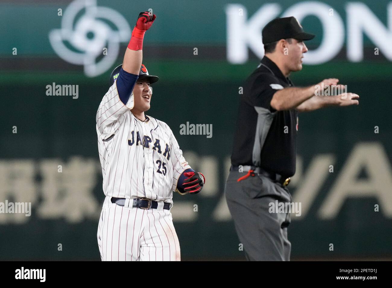 Kazuma Okamoto of Japan reacts after hitting RBI double as second base ...