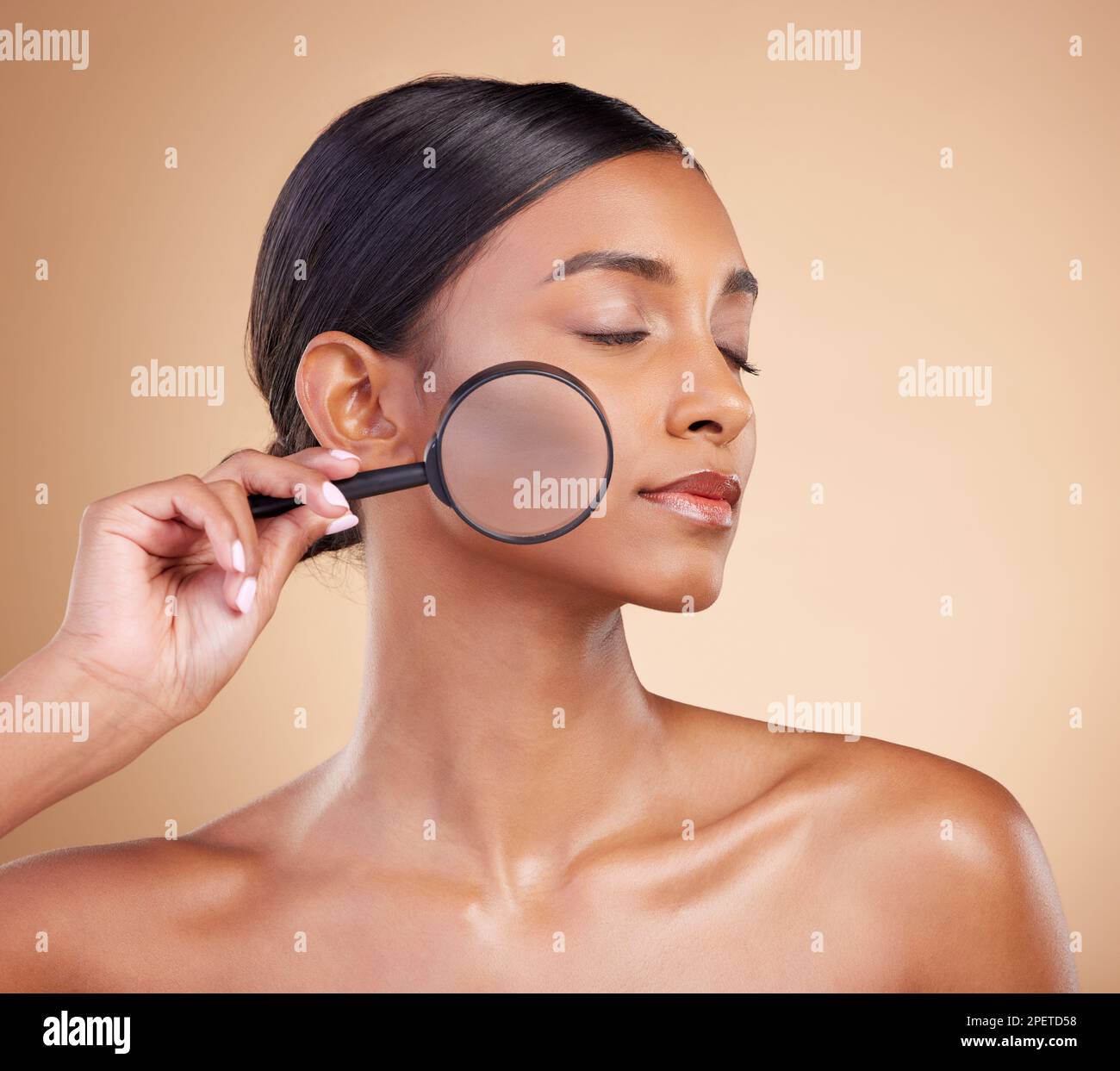 Skincare, model face or woman with magnifying glass in studio on beige ...