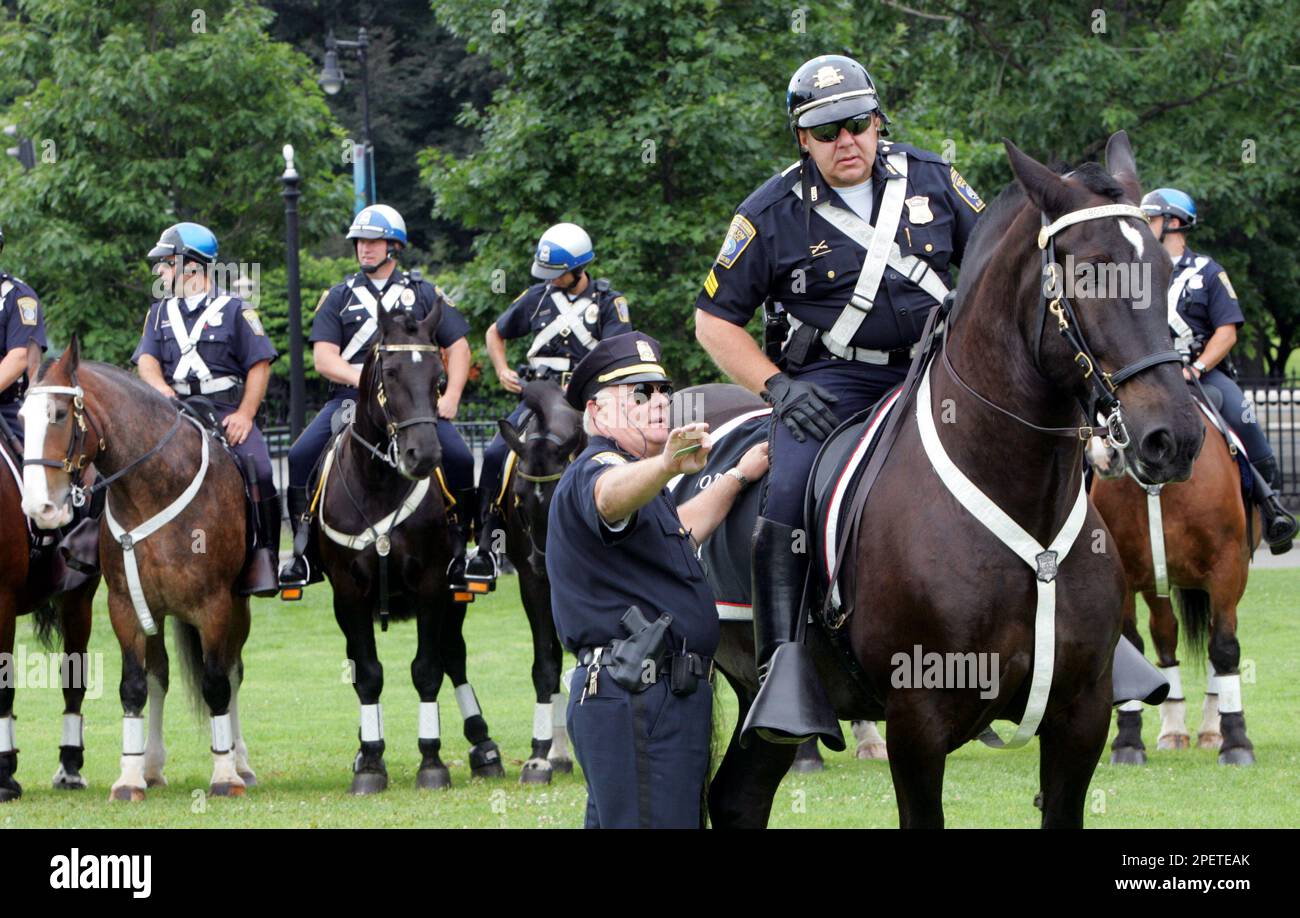 Boston Police Supt. Robert Dunford, standing, indicates the staging ...