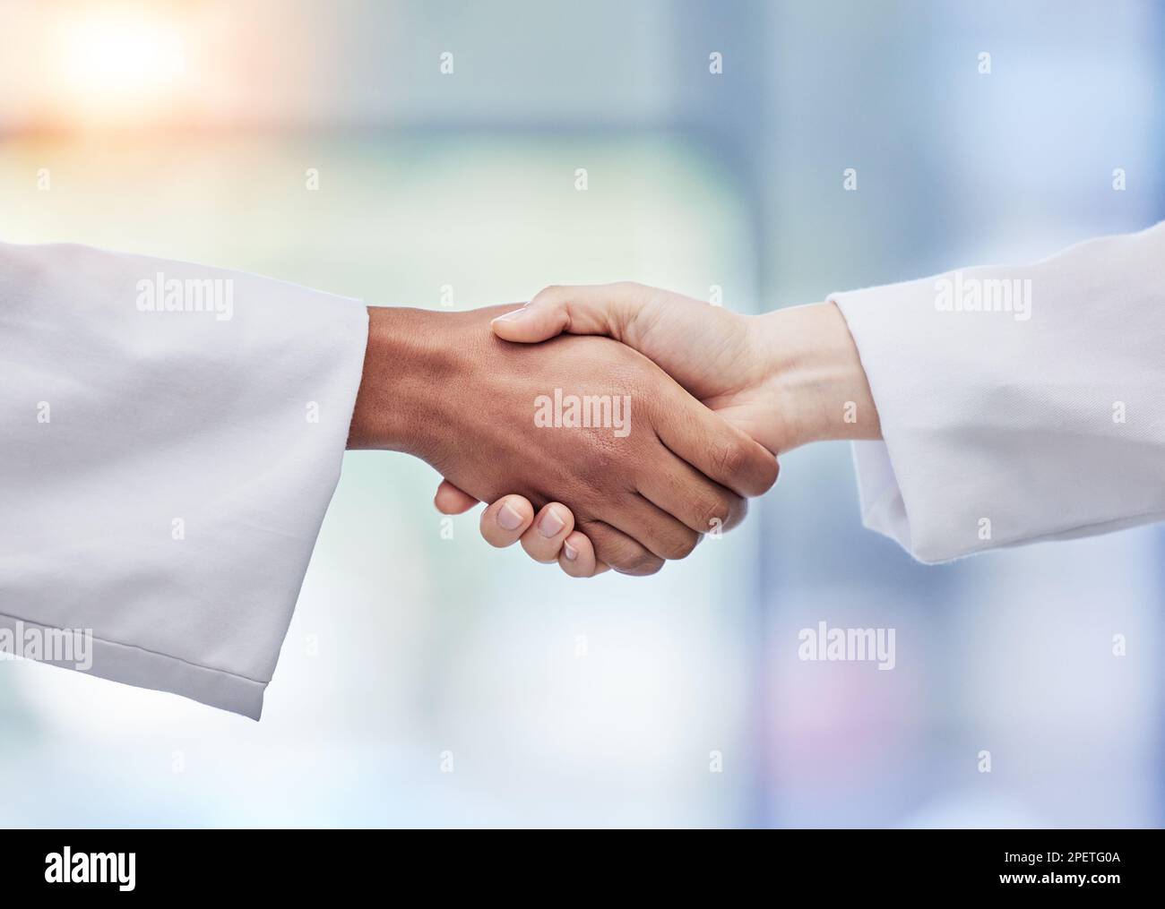 Doctors, handshake and healthcare partnership in agreement, teamwork ...