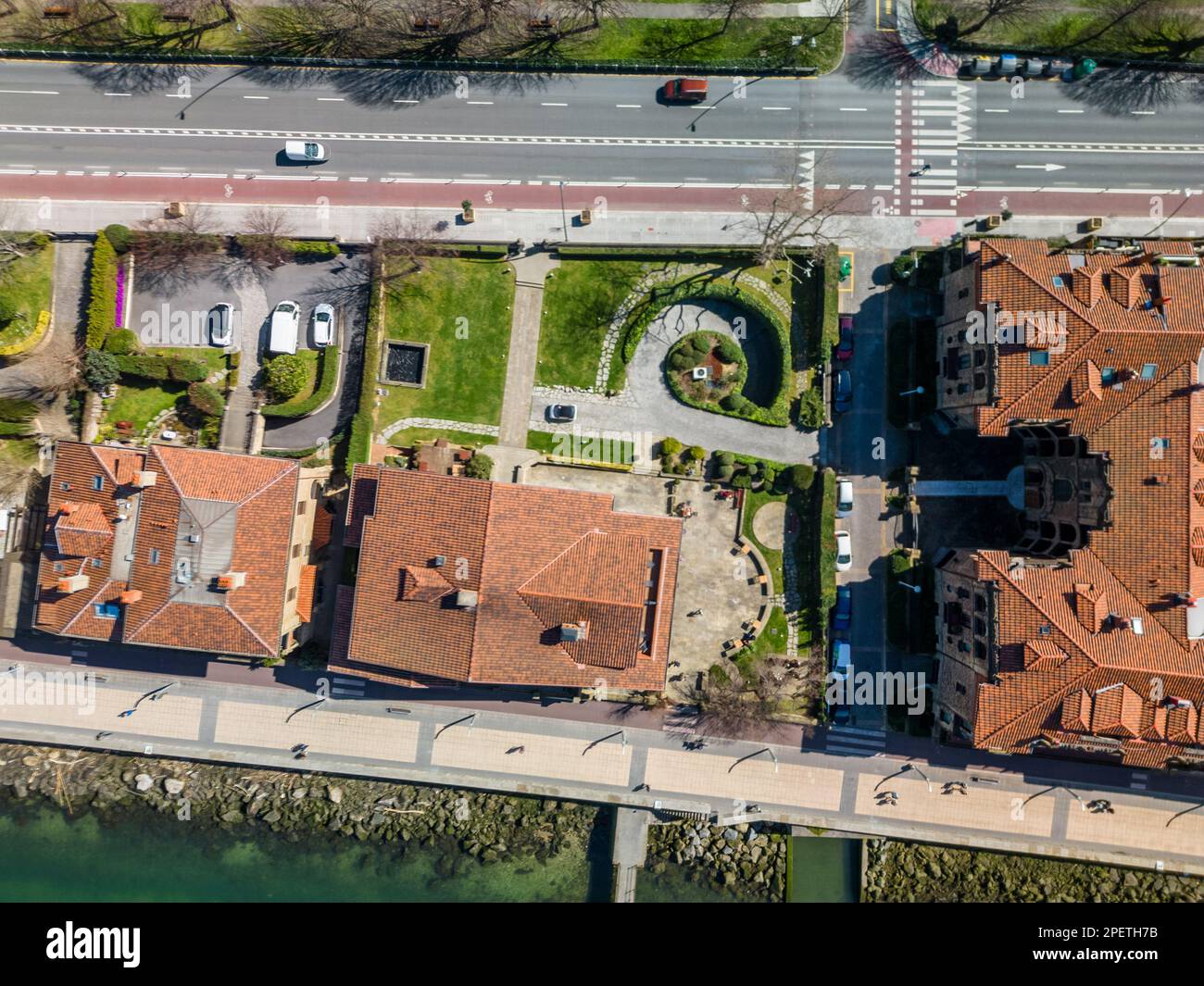Aerial view of cityscape with road winding through buildings Stock ...