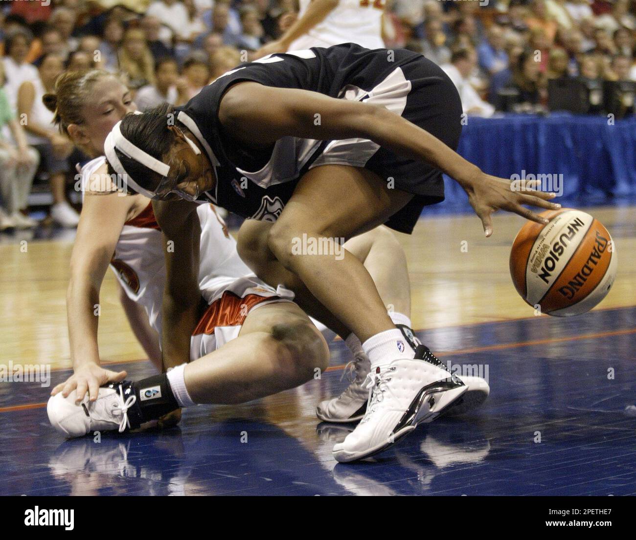 San Antonio Silver Stars' Semeka Randall, right, reaches for the loose ...