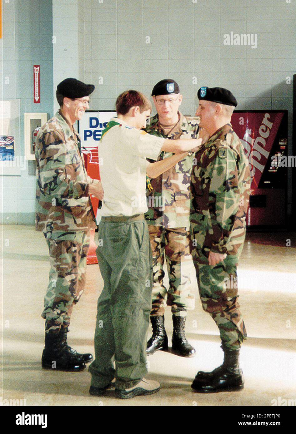 Will Waldrop, 15, pins major bars on his father, Maj. Johnny Waldrop ...