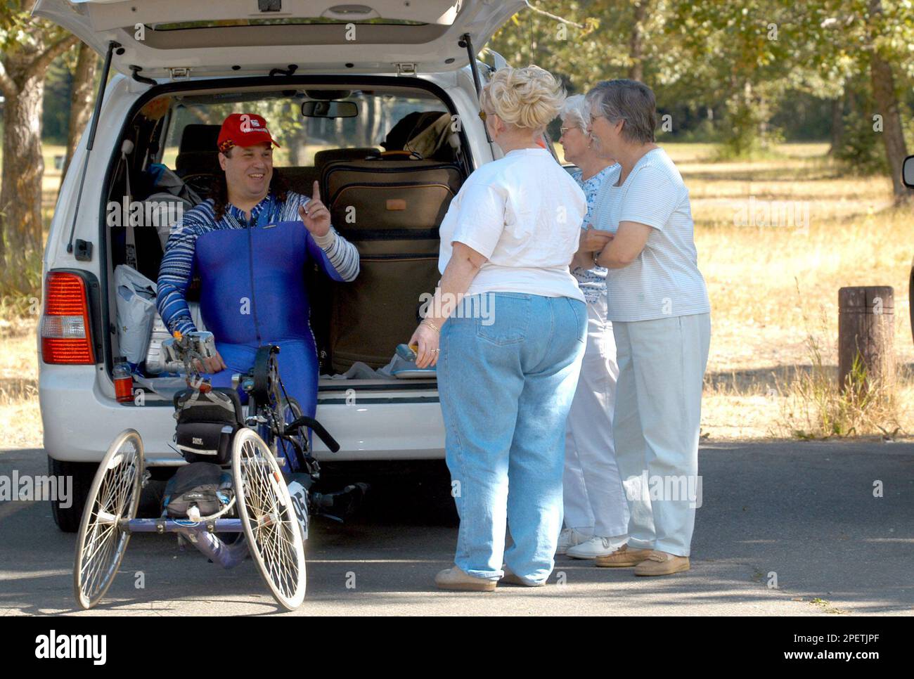 Larry Coutermarsh of North Pole, Alaska, left, visits with fans ...