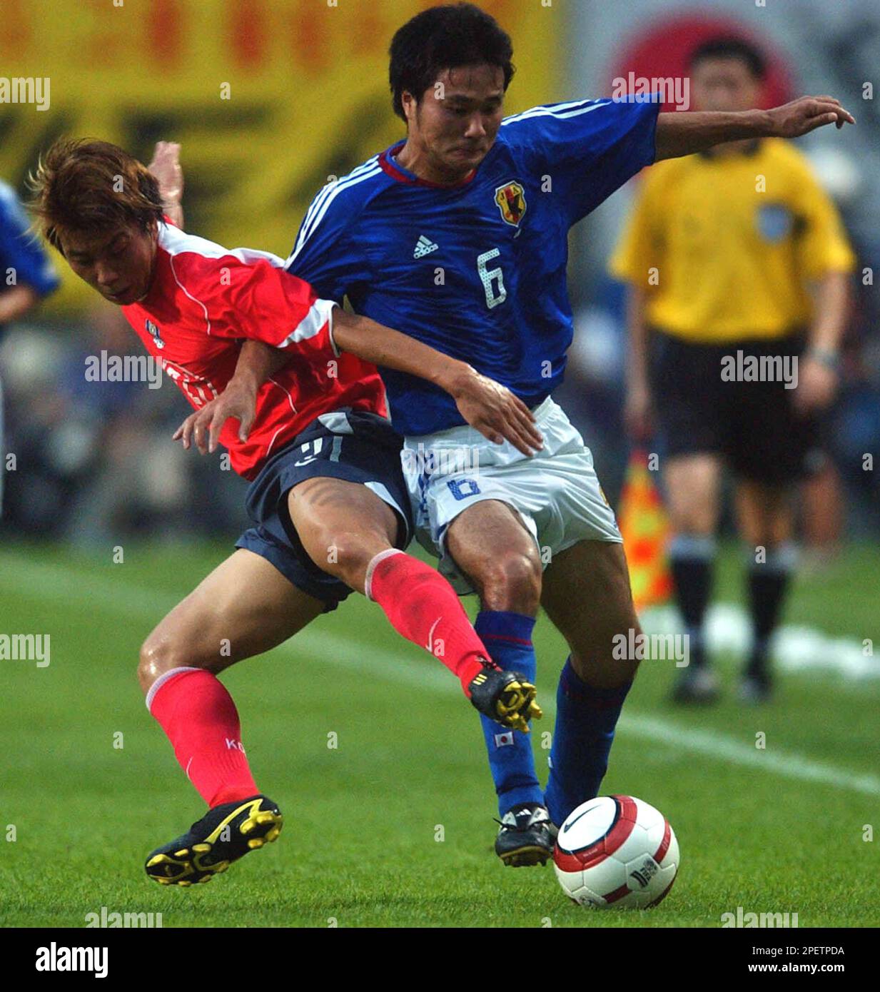 Japan's U-23 national team Yasuyuki Konno, right, fights for a ball ...