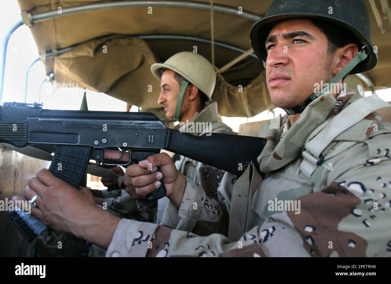 Iraqi Army 2nd Battalion soldiers ride on patrol in the al-Dora section ...
