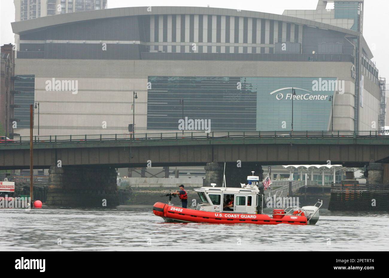 A United States Coast Guard response boat patrols Boston Harbor in ...