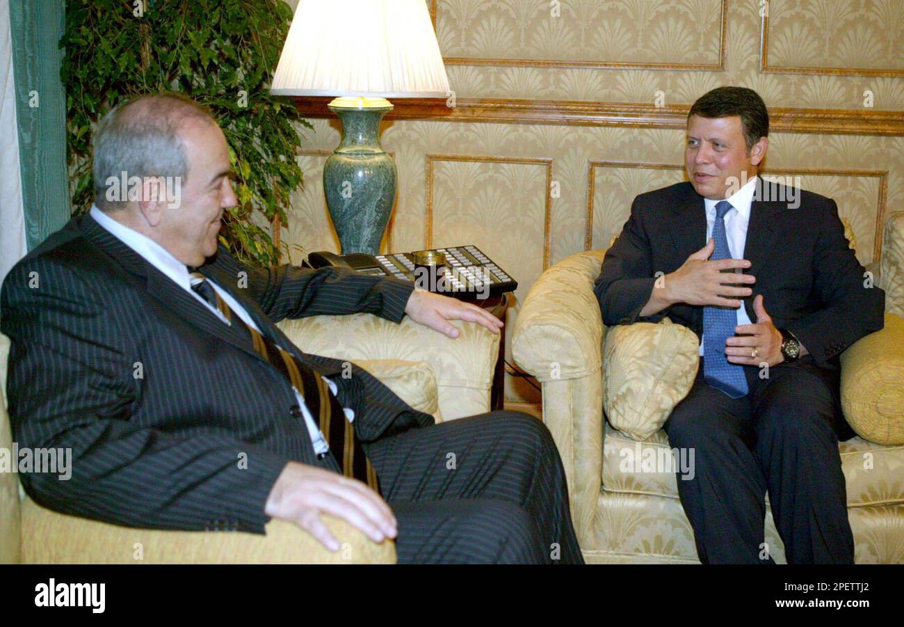 King Abdullah II of Jordan, right, talks with Iraqi Prime Minister Ayad ...