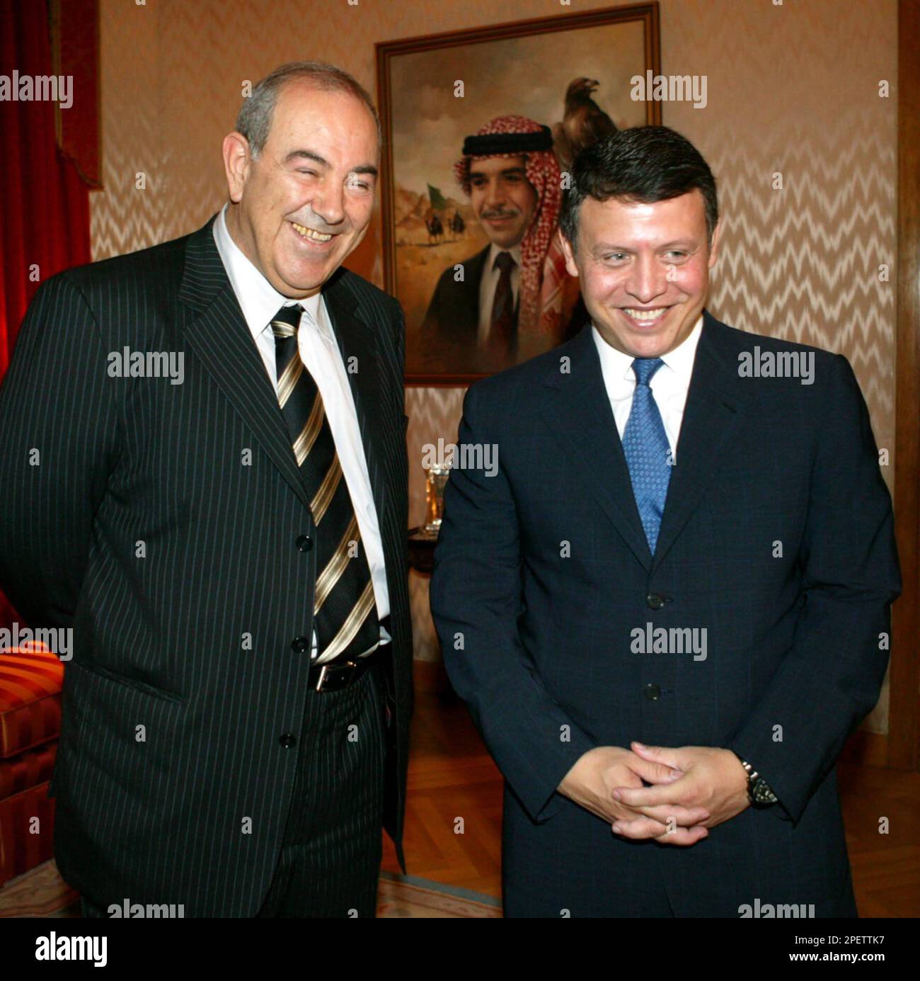 King Abdullah II of Jordan, right, welcomes Iraqi Prime Minister Ayad ...