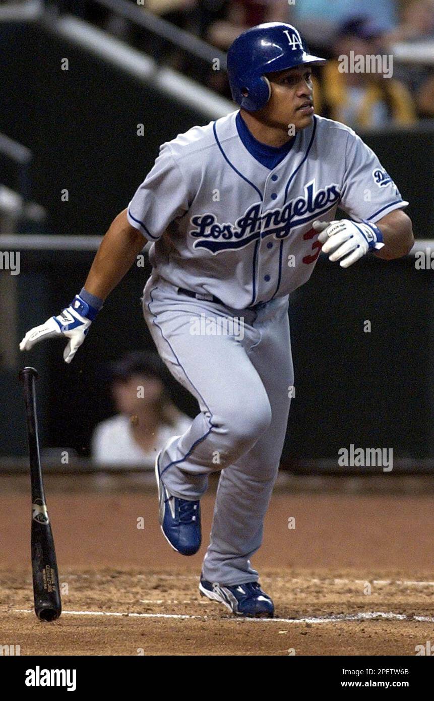 Los Angeles Dodgers' Cesar Izturis watches his three-run homer in the ...