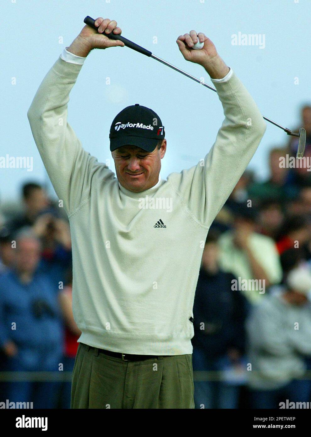 Todd Hamilton of the United States grimaces as he stretches on the 13th ...