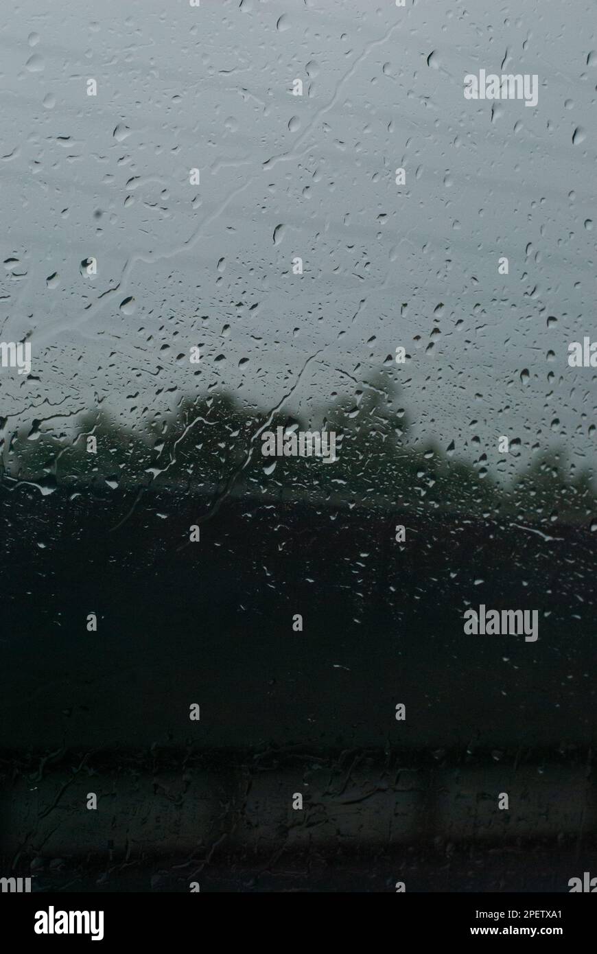 Raindrops on car in rainy hi-res stock photography and images - Alamy