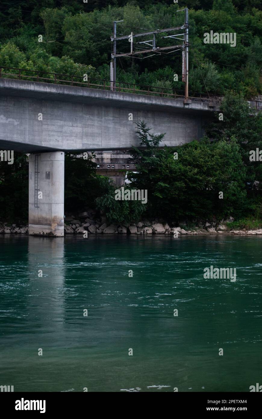 View on bridge over mountain river with blue water Stock Photo - Alamy