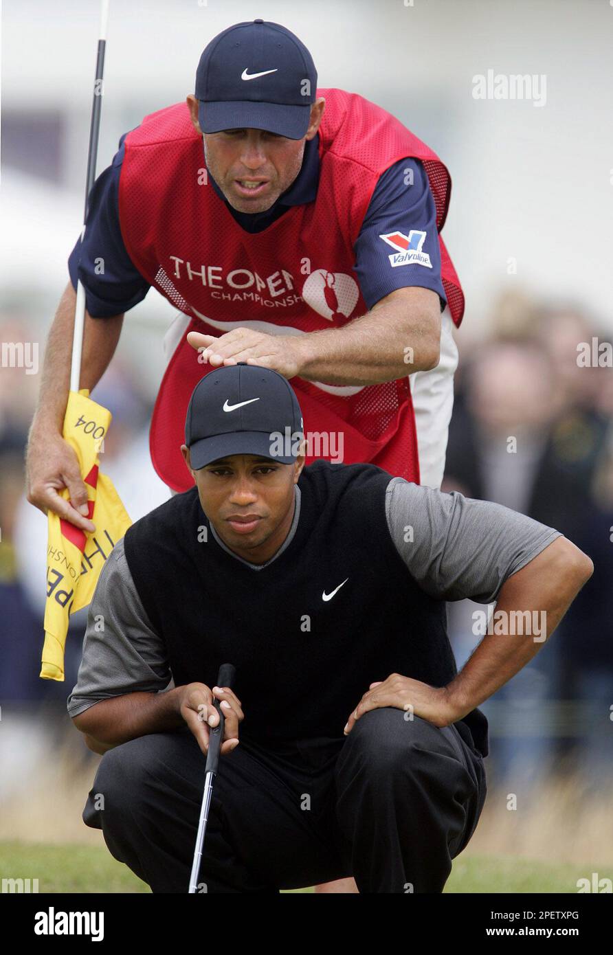 Tiger Woods of the United States and his caddie Steve Williams line up ...