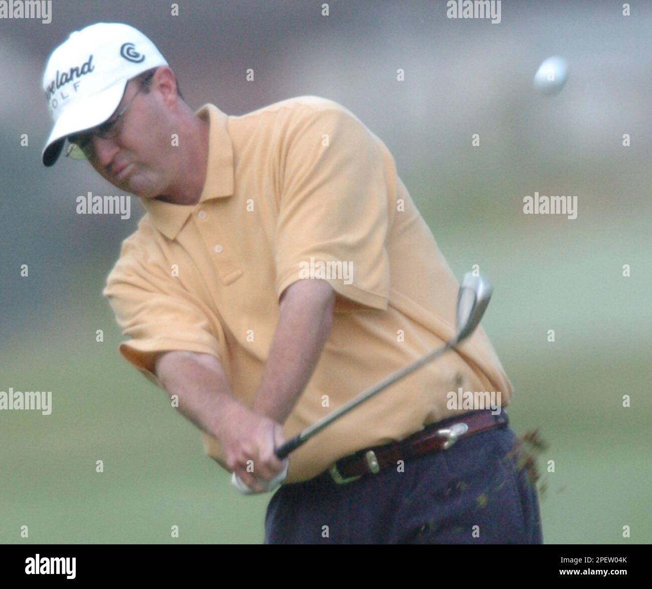 Scott Petersen strikes his second shot on the first hole at Pete Dye ...