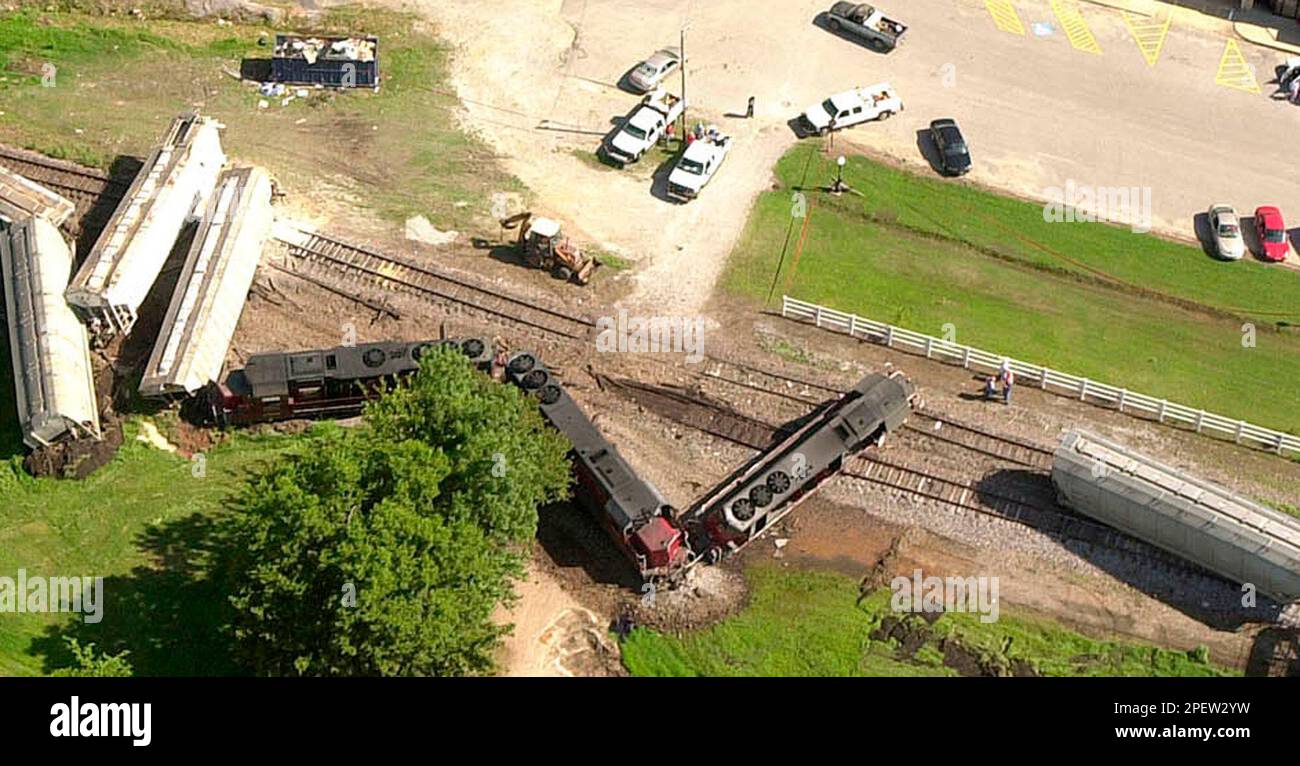 Locomotives and rail cars sit on the tracks in Newark, Ark., Tuesday ...