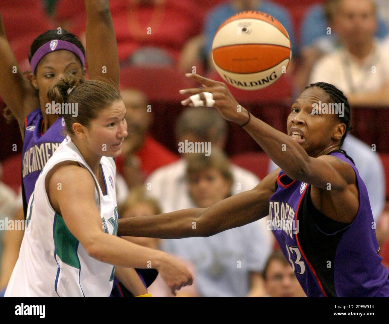 Minnesota Lynx guard Amber Jacobs, left, and Sacramento Monarchs ...