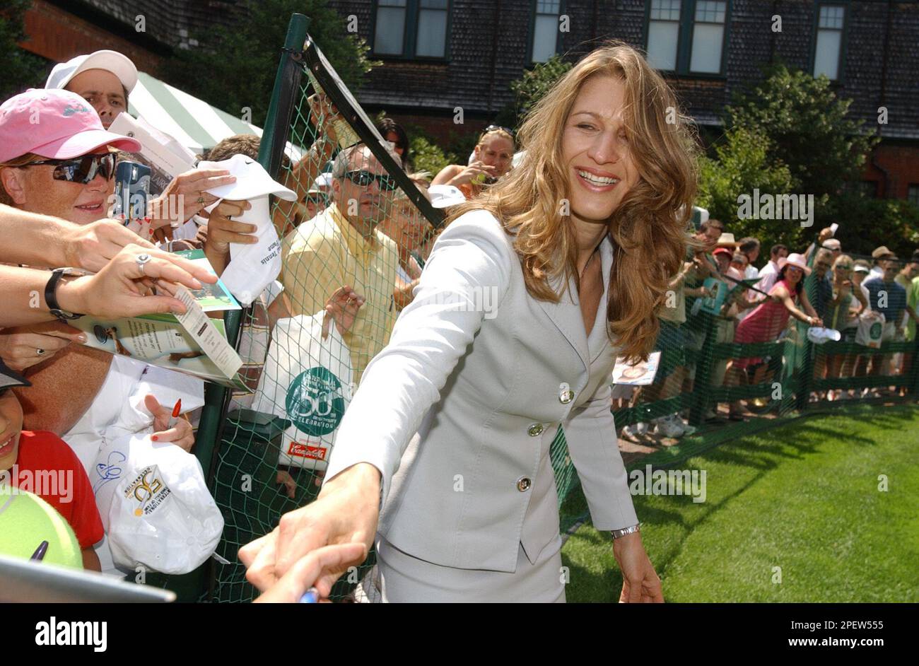 Steffi Graf signs autographs for fans following her induction into the ...