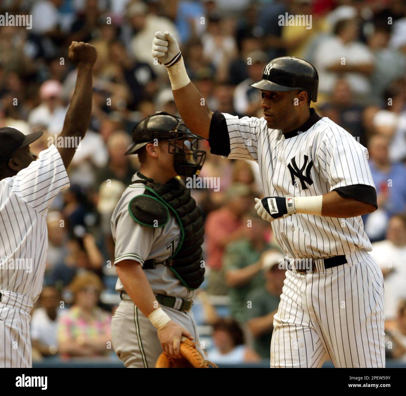 New York Yankees Tony Clark celebrates with the Yankees bat boy ...