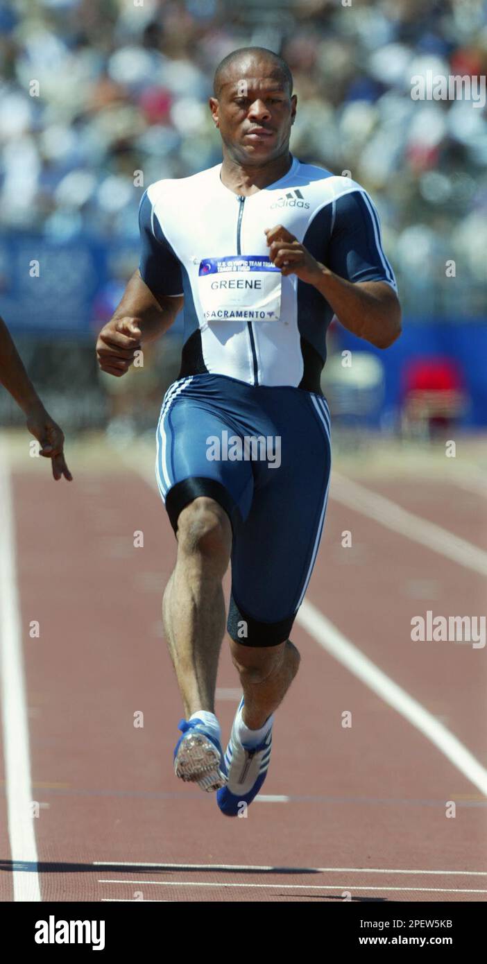 Maurice Greene crosses the finish line during his qualifying heat in ...