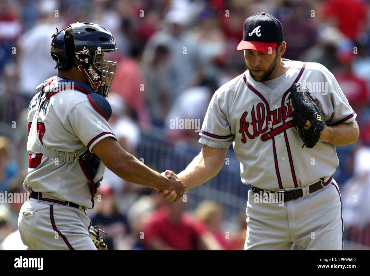 Atlanta Braves' pitcher John Smoltz, right, celebrates with Johnny ...