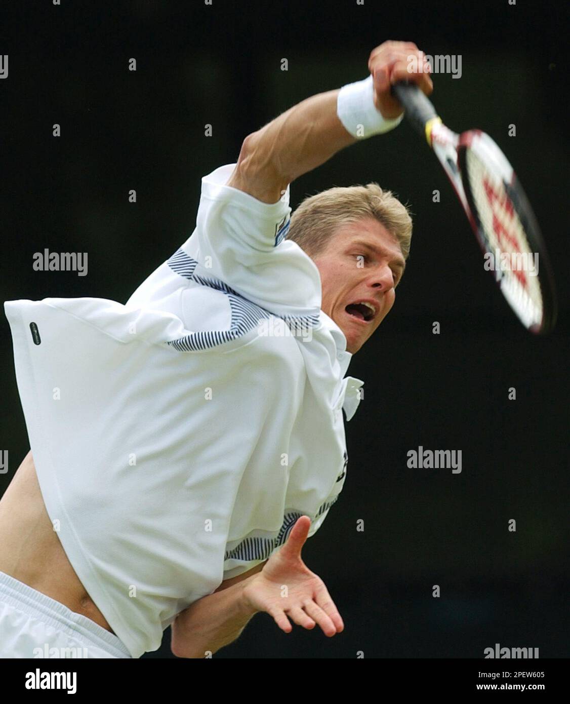 Alexander Popp, of Germany, serves to Cyril Saulnier, of France, during ...