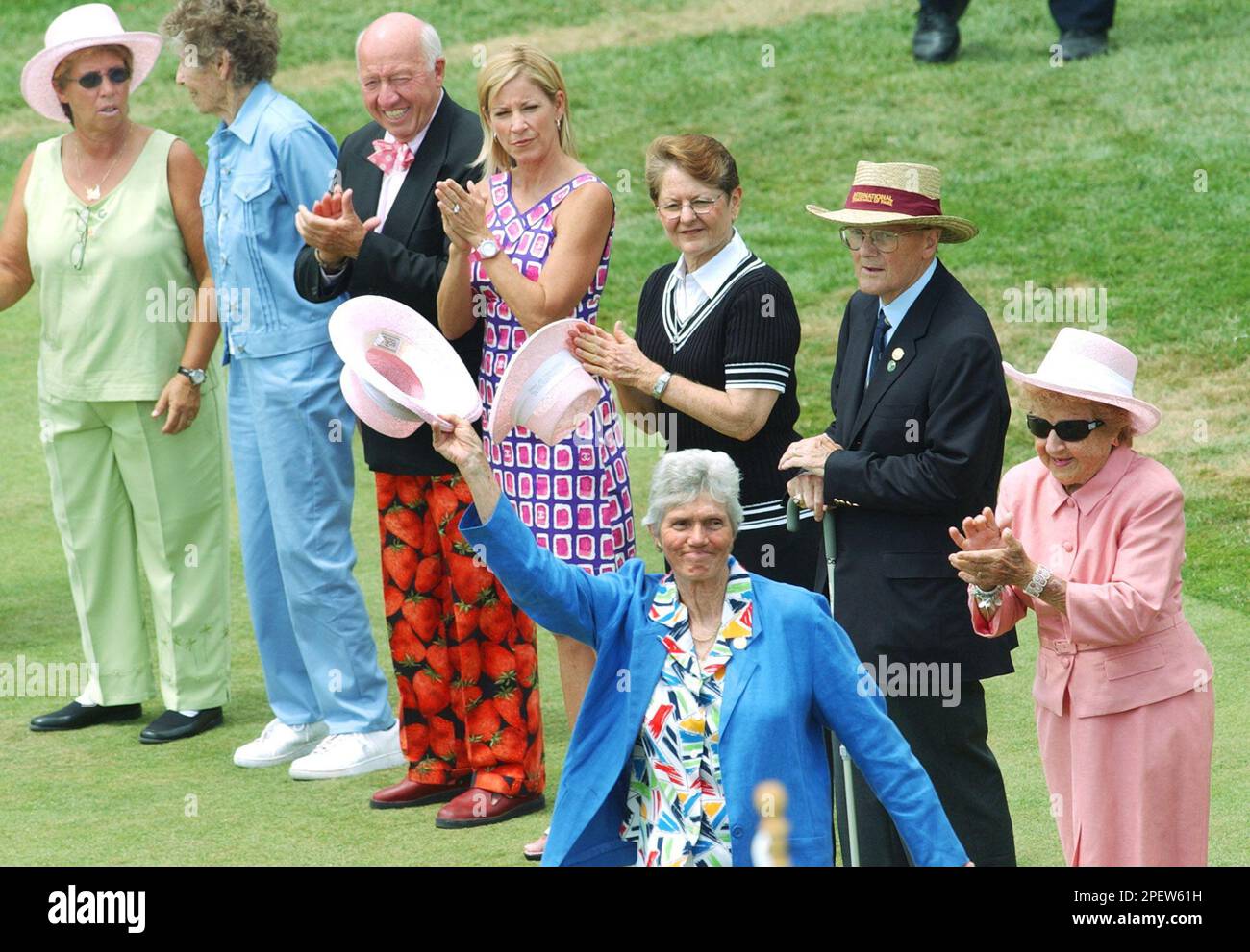Tennis great Shirley Fry-Irvin of the U.S. waves her hat to the crowd ...