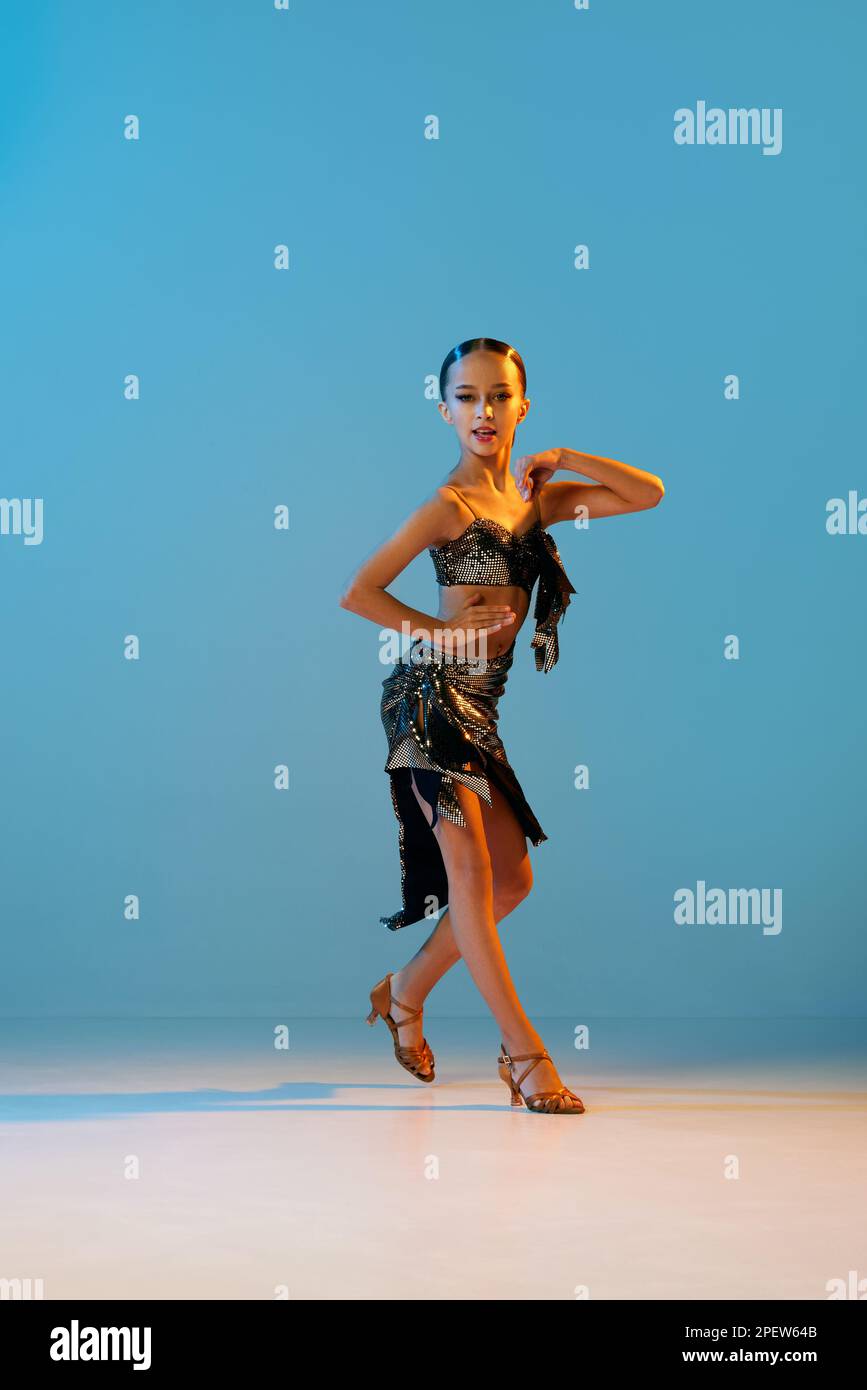 Samba dance. Beautiful little girl in stage attire dancing latino ...