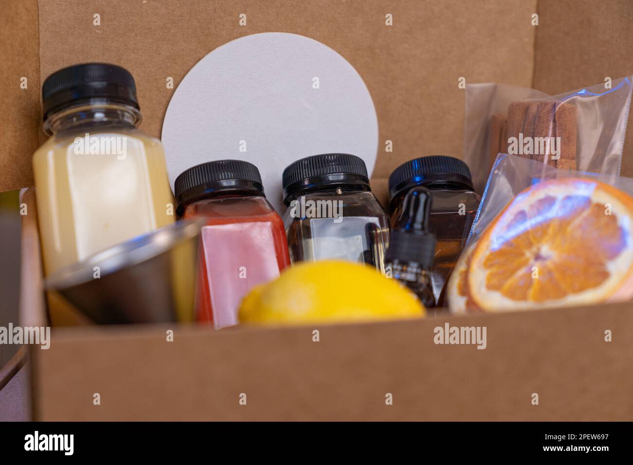 a take-home cocktail making box with various ingredients for creating ...
